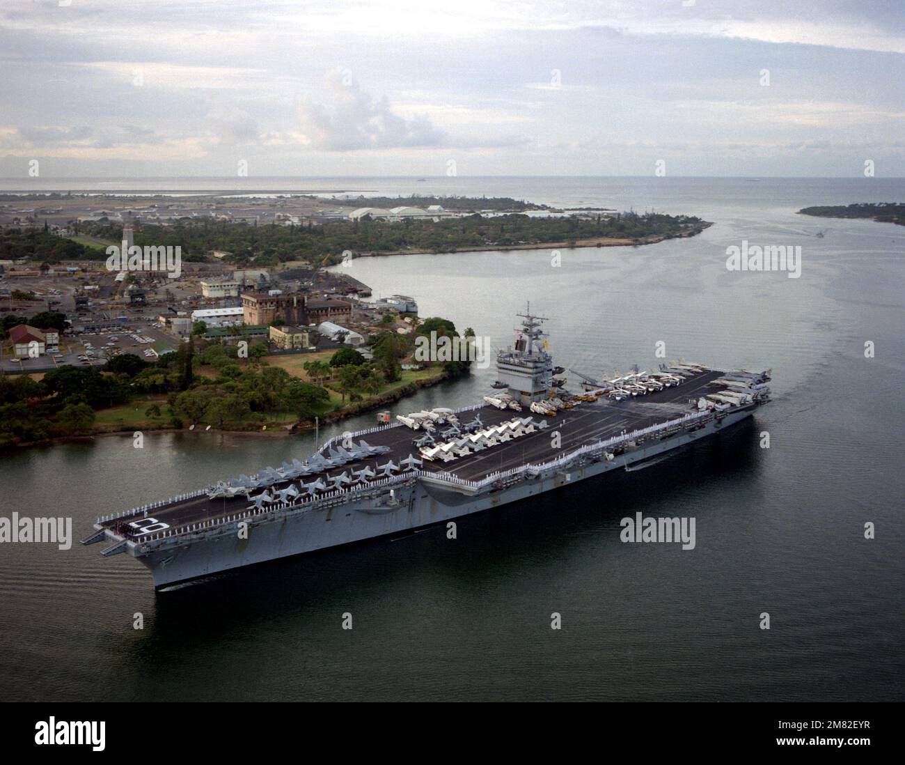 An aerial port bow view of the nuclear-powered aircraft carrier USS ...