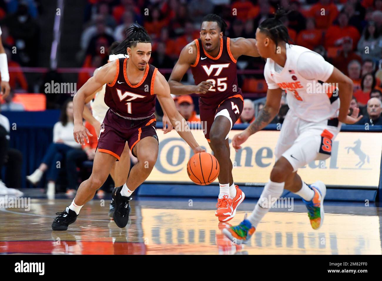 Virginia Tech guard Rodney Rice, left, is defended by Syracuse guard ...