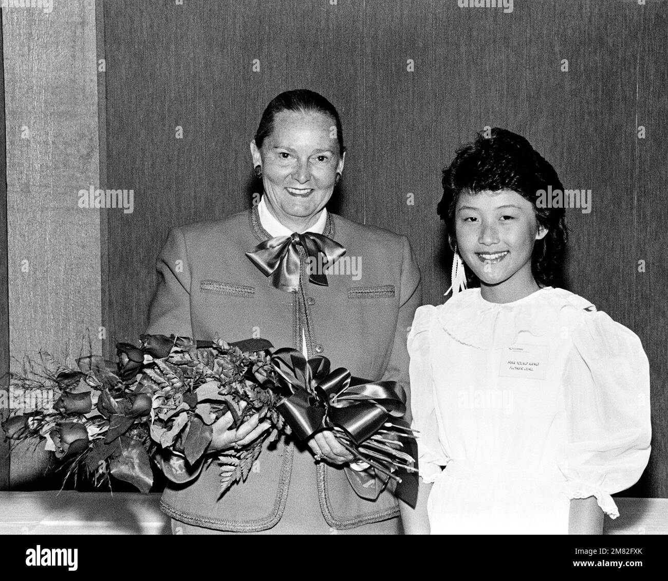 Mrs. Paul Xavier Kelley, sponsor, and Miss Hwa Young Kang, flower girl ...