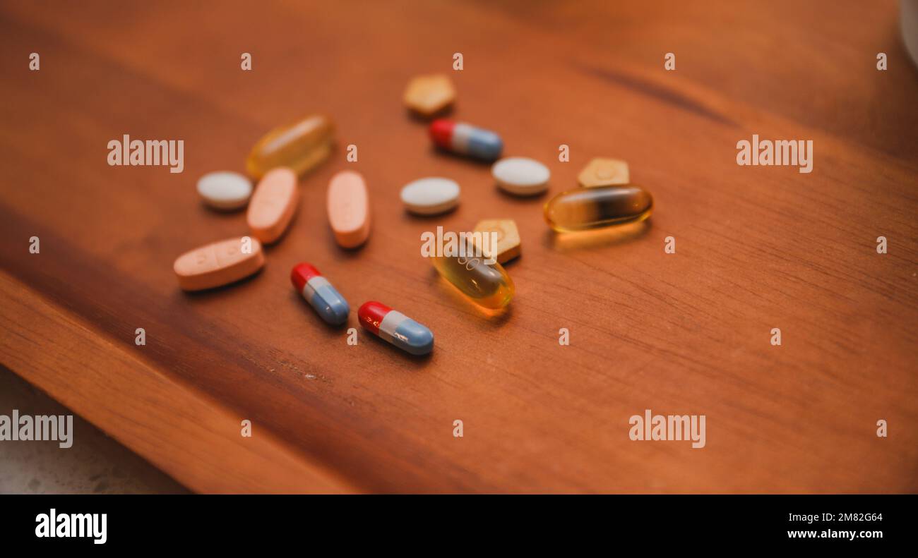 medication pills for sick hand them medicine tablets Stock Photo - Alamy