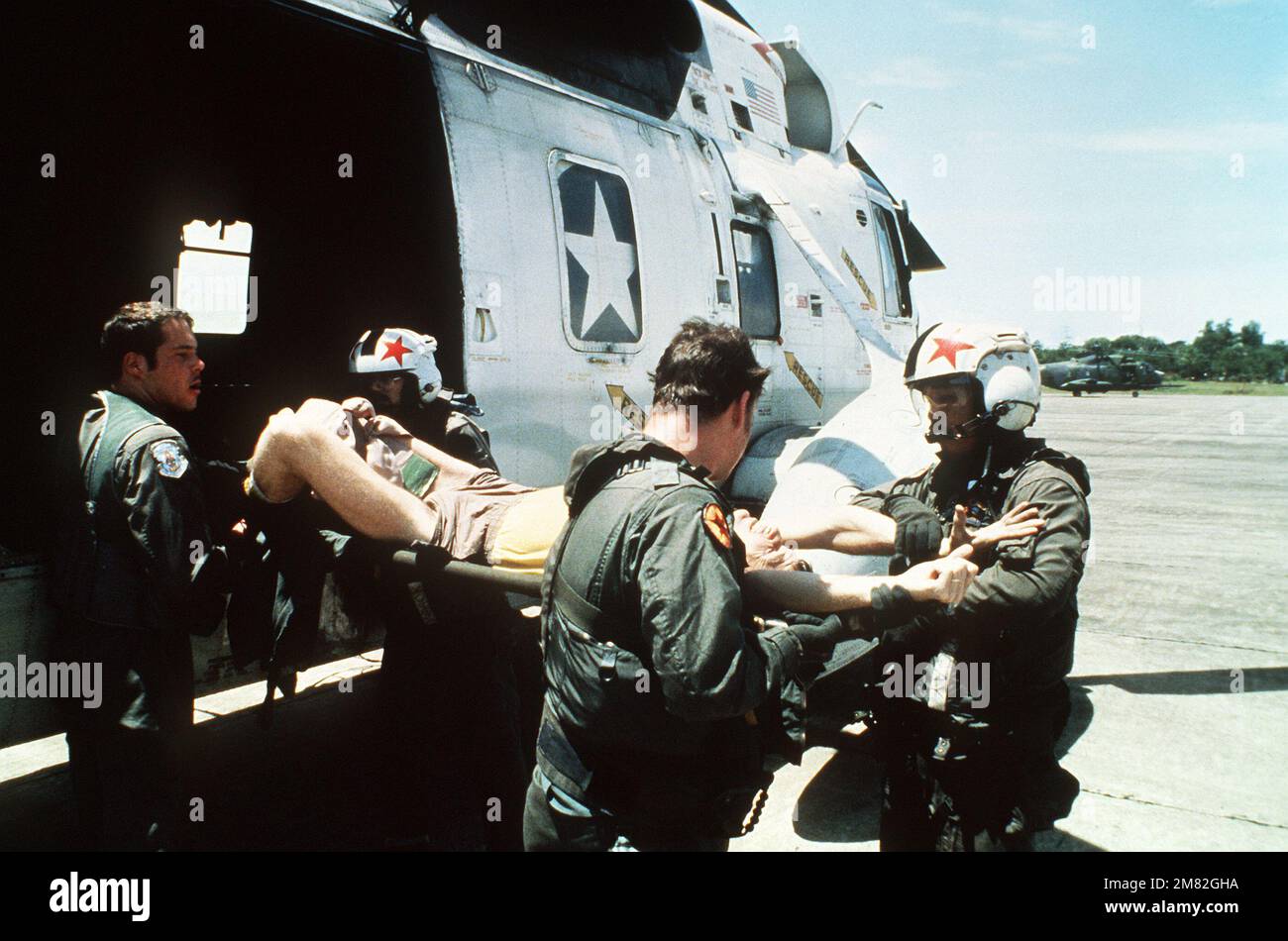 Crash victim LT. j.g. Eric Patenkopf is transferred from an SH-3 Sea ...