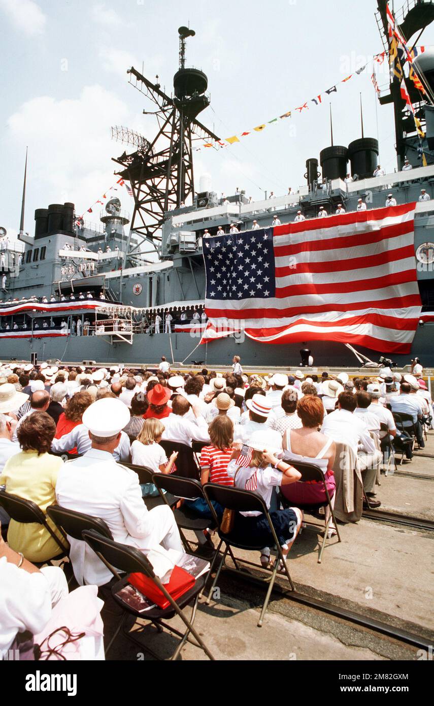 The crew of the Aegis guided missile cruiser USS YORKTOWN (CG 48) man ...
