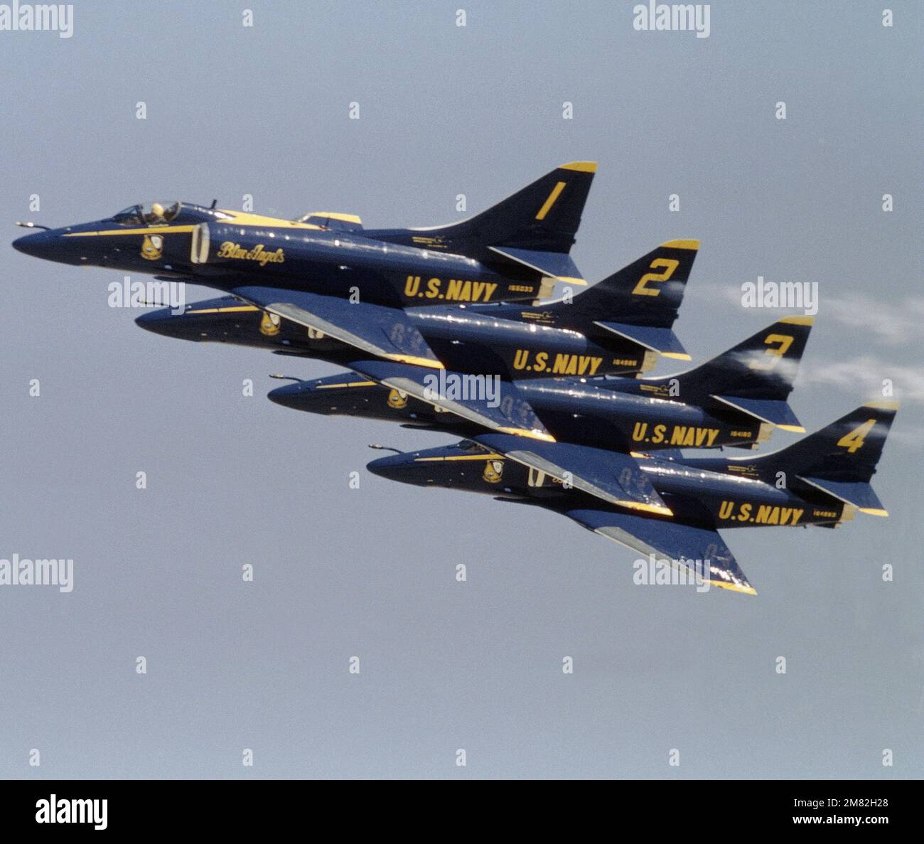 An air-to-air left side view of four A-4F Skyhawk aircraft assigned to ...