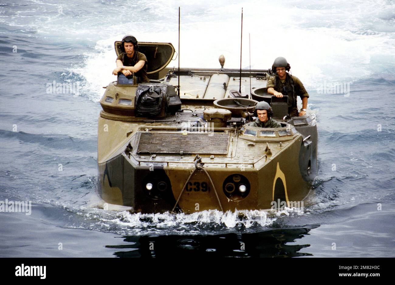 A US Marine Corps AAVP-7 amphibious assault vehicle heads back to the ...