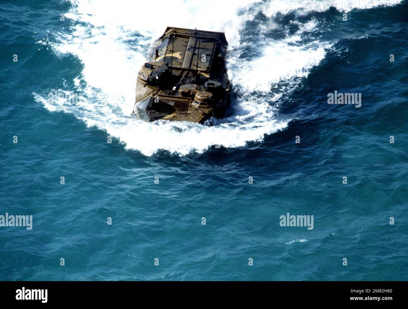 A US Marine Corps AAVP-7 amphibious assault vehicle carrying a squad of ...