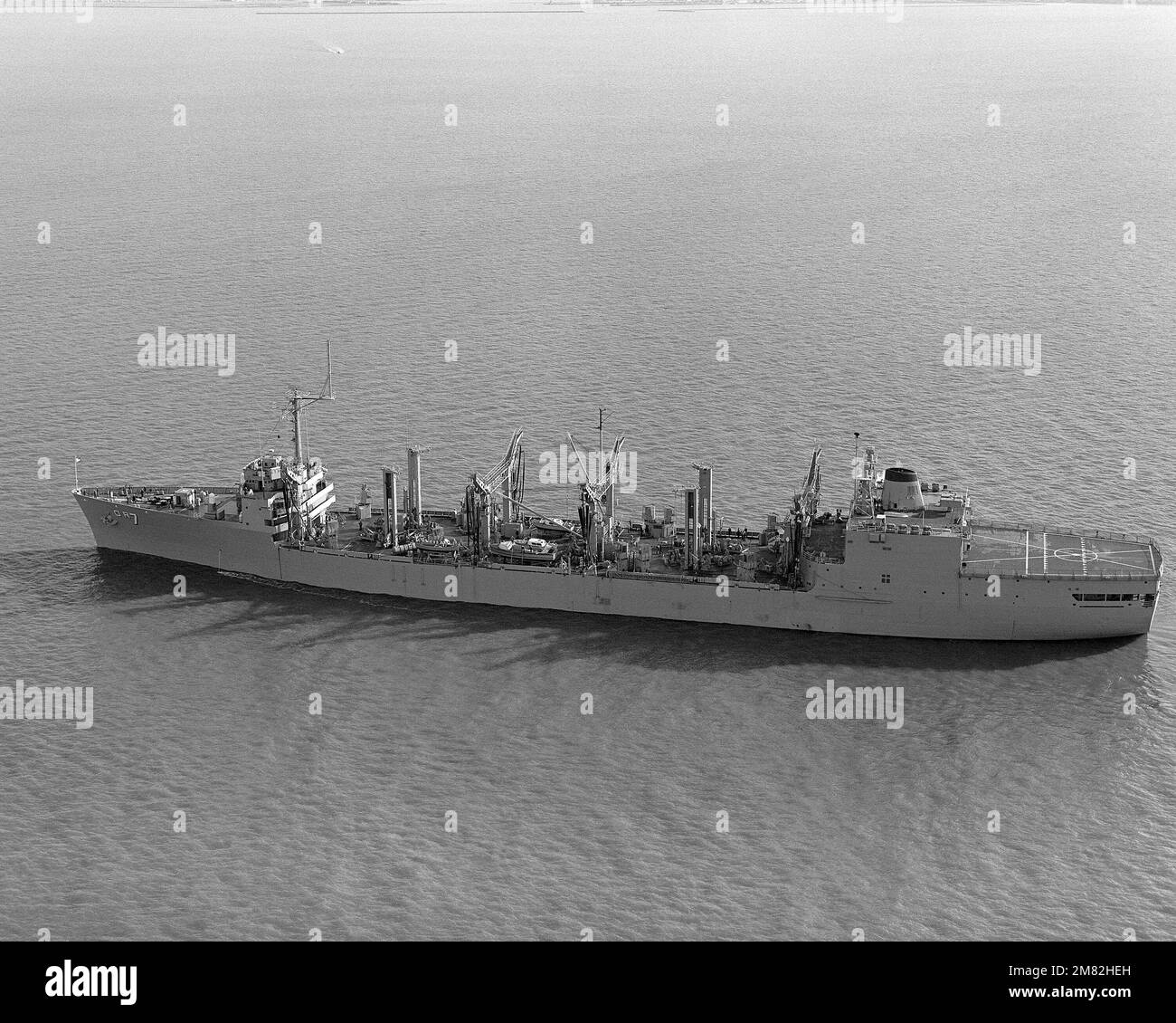 Aerial port beam view of the anchored replenishment oiler USS ROANOKE ...