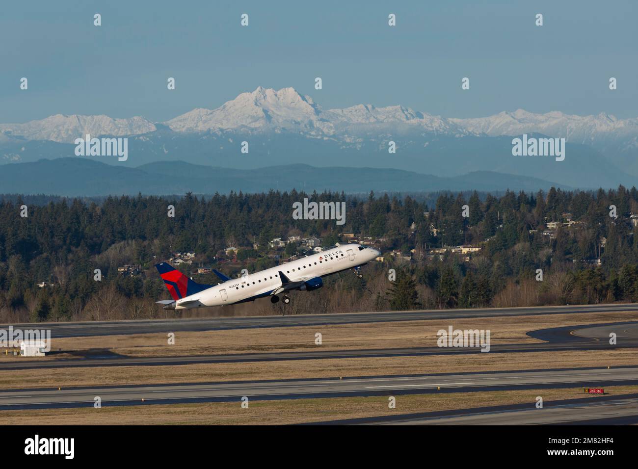 A Delta Airlines Embraer 175 takes off at Seattle-Tacoma International ...