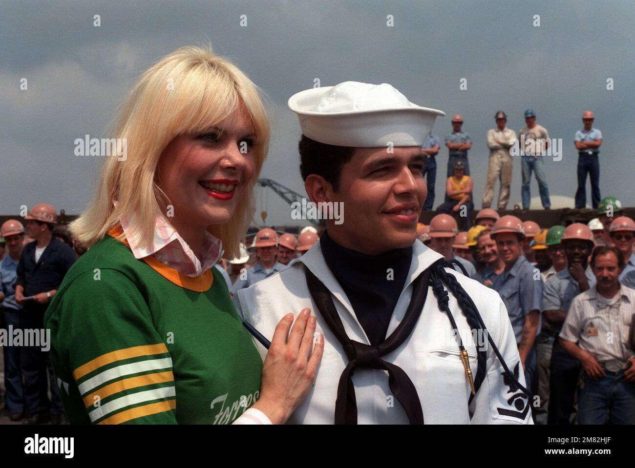 Actress Ann Jillian greets a sailor after a show with Bob Hope on board ...