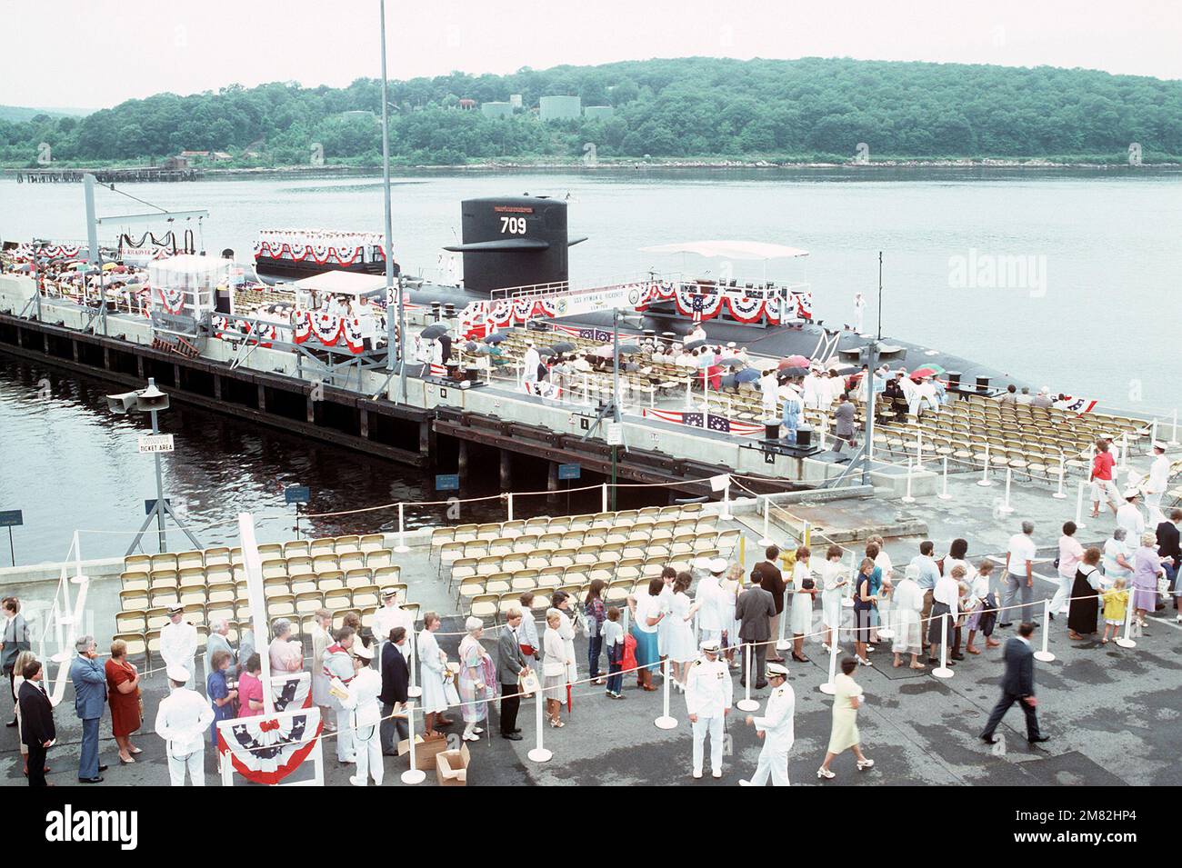 Guests arrive to attend the commissioning ceremony for the Los Angeles ...