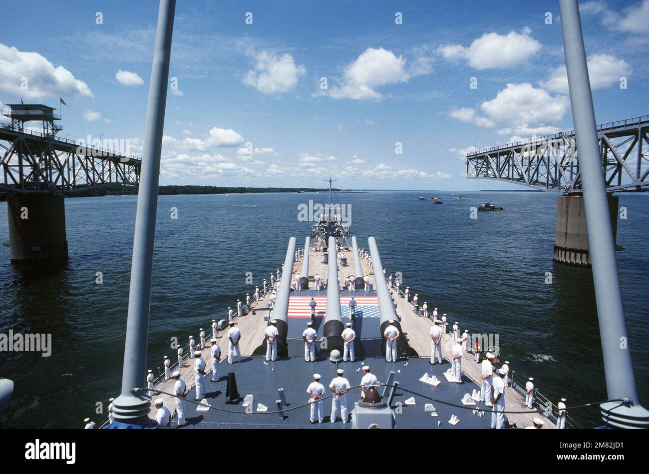 The crew of the battleship USS IOWA (BB 61) mans the rails as the ship ...