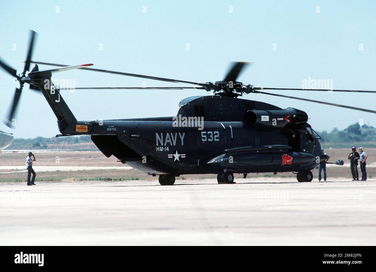 A right side view of an RH-53D Sea Stallion helicopter as members of ...