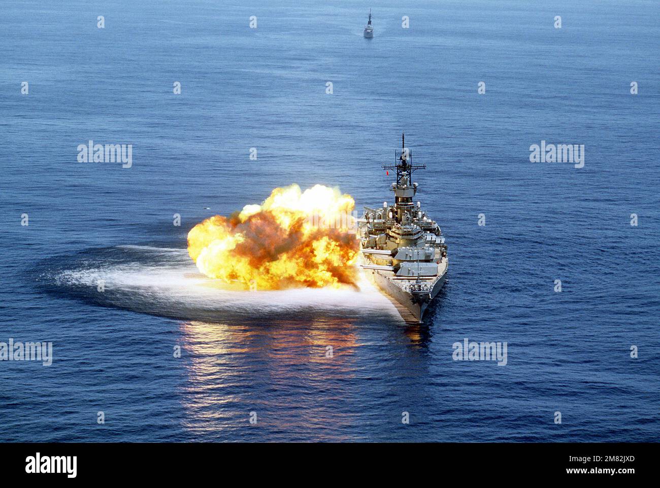 An aerial bow view of the battleship USS IOWA (BB-61) with its 15 guns ...