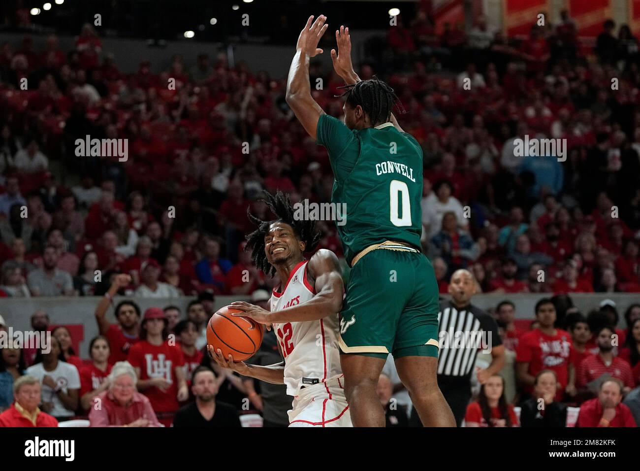 Houston's Tramon Mark (12) is fouled by South Florida's Ryan Conwell (0 ...
