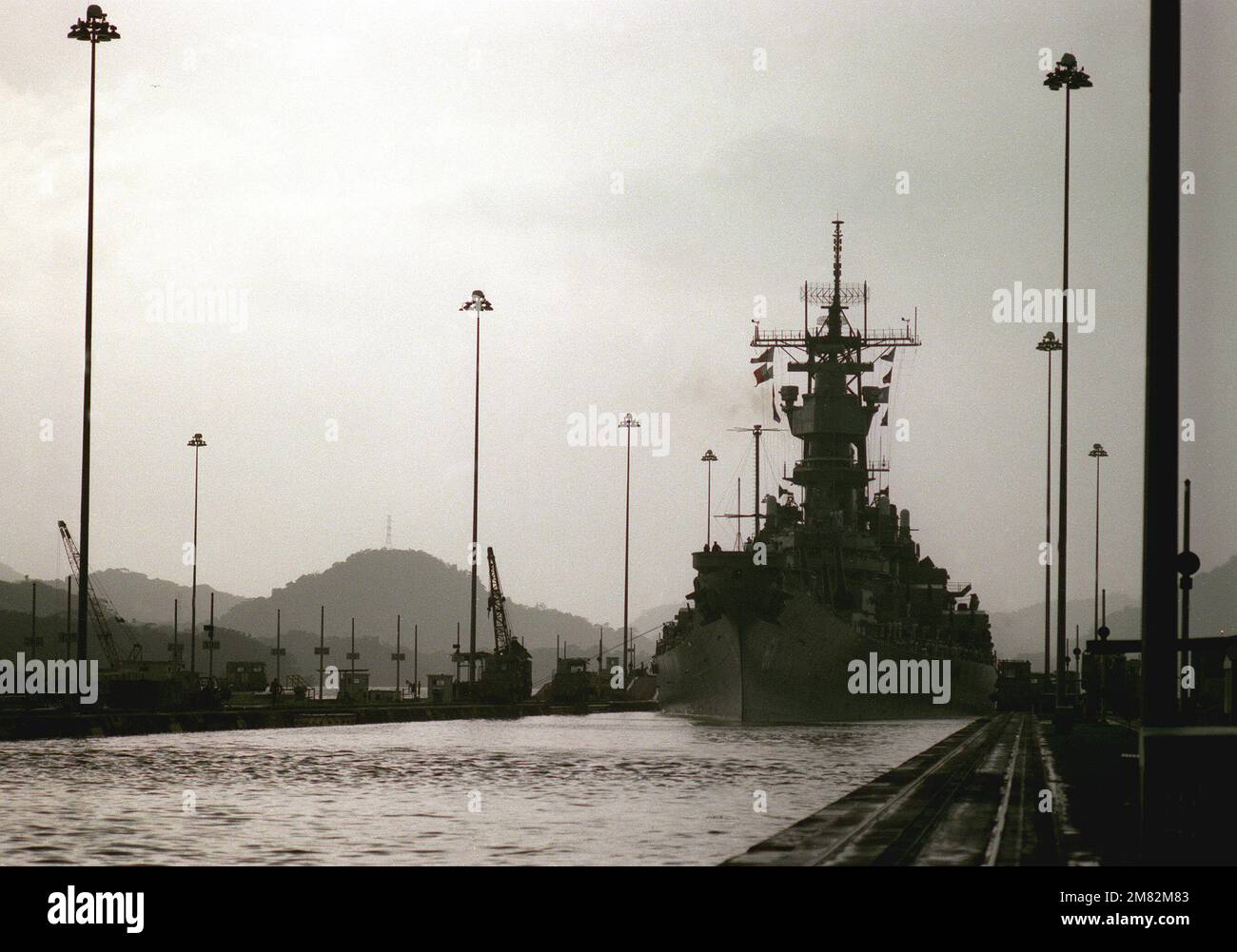 A port bow view of the battleship USS IOWA (BB-61) passing through the ...