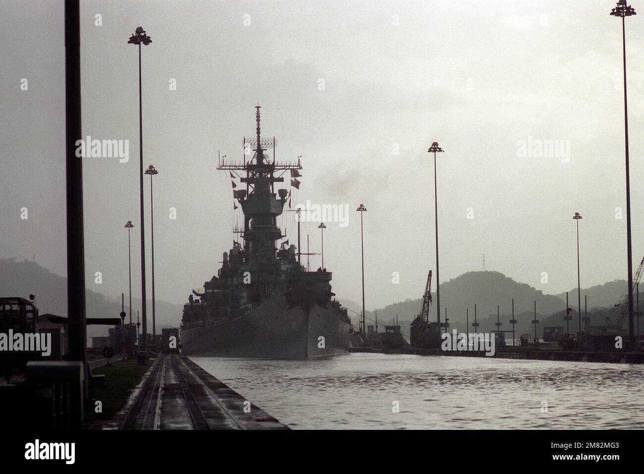 A bow view of the battleship USS IOWA (BB-61) passing through the Pedro Miguel Locks. Base ...