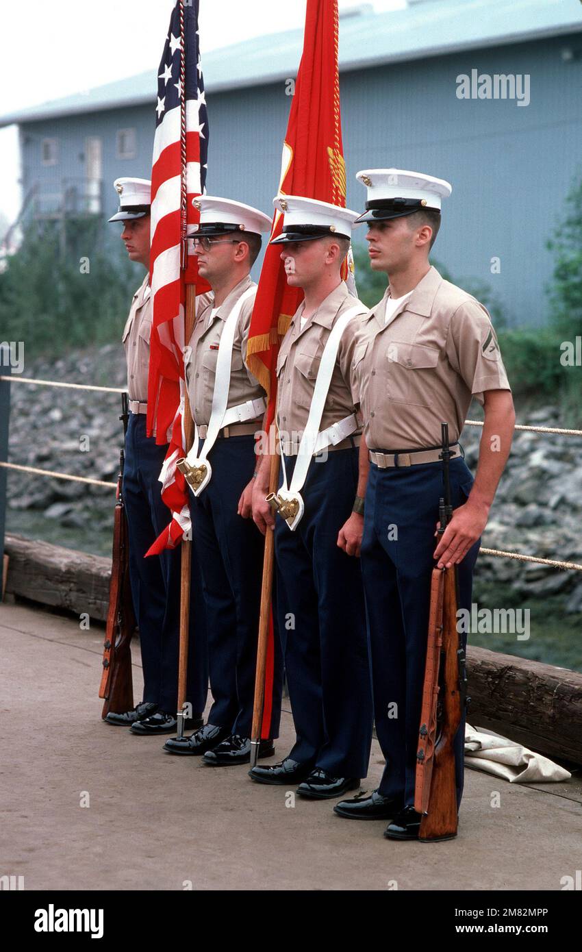 A Marine Corps color guard stands at attention during the commissioning ...