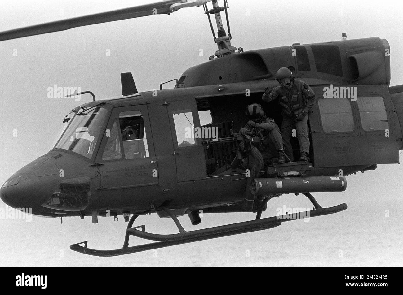 A U.S. Air Force UH-1N Iroquois helicopter approaches the flight deck ...