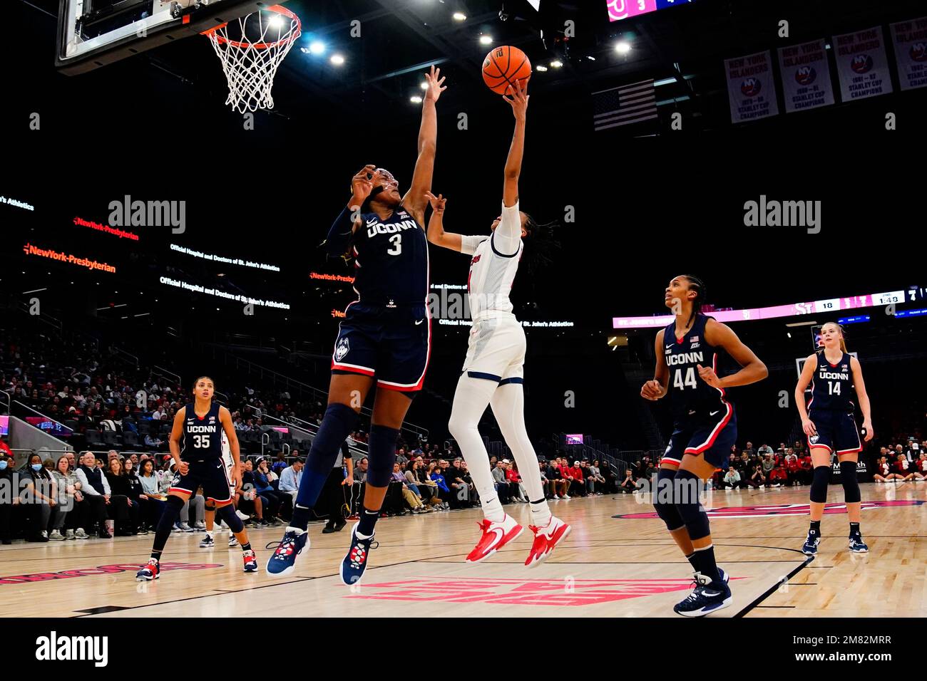 Connecticut's Aaliyah Edwards (3) defends a shot by St. John's Jayla ...