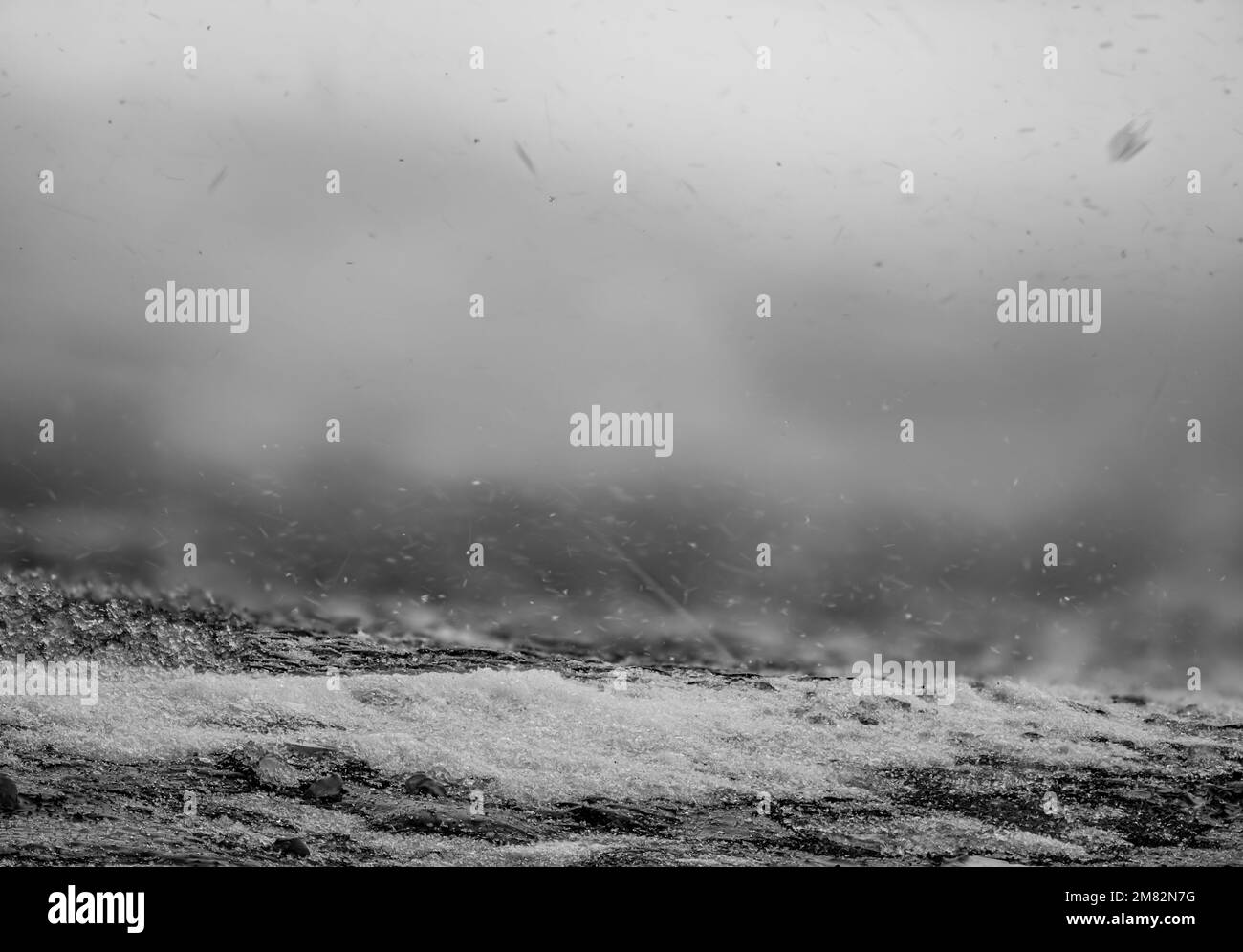 Blowing snow and Focus stacked ground level view of ice accumulation on ...