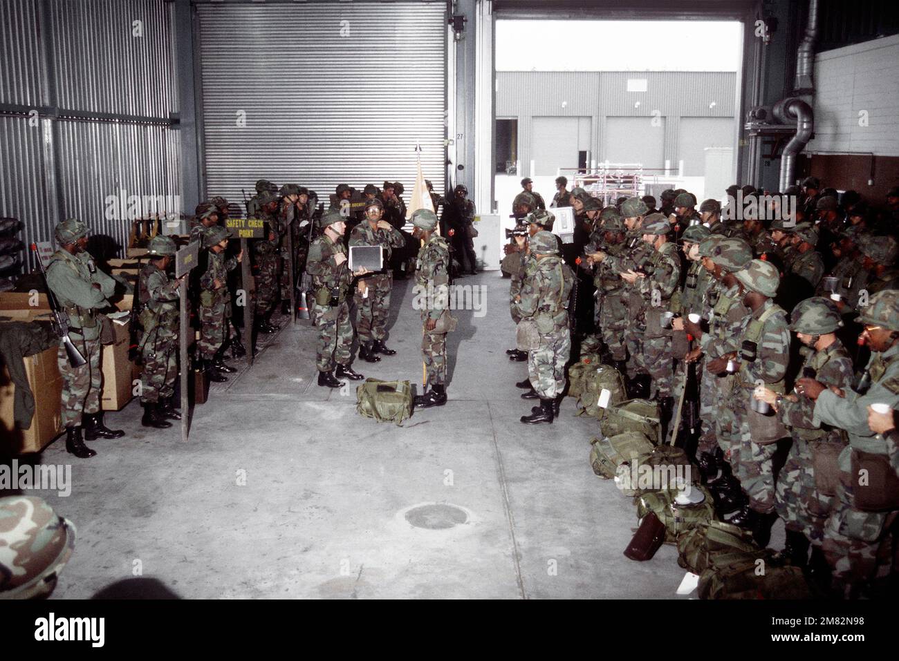 Members of the 42nd Signal Battalion receive a safety briefing from ...