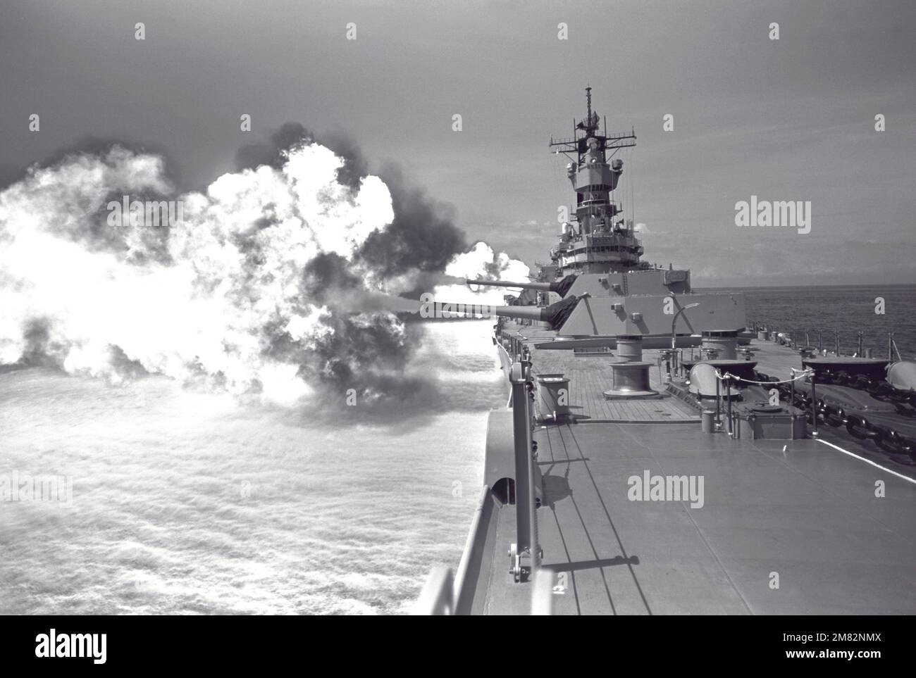 The battleship USS IOWA (BB-61) fires a broadside to starboard from the ...