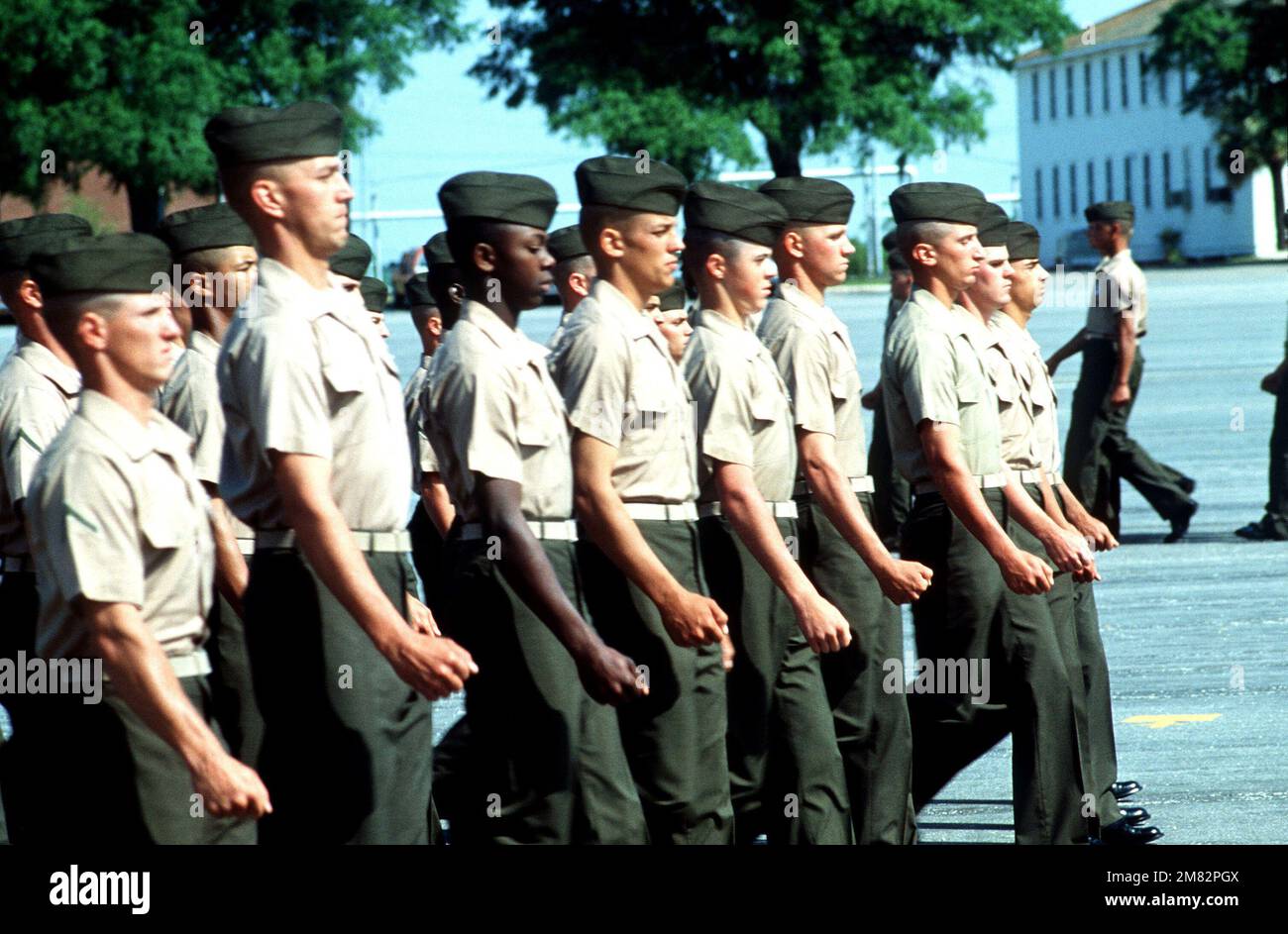 Marines march on the drill field during their graduation from basic ...