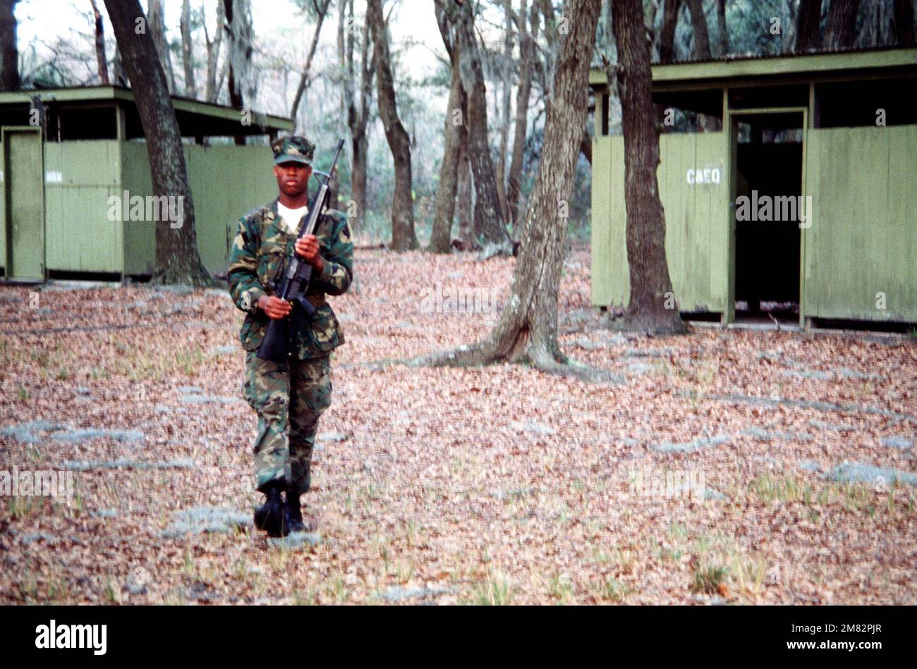 A Marine recruit, armed with an M16A1 rifle, during basic training at ...