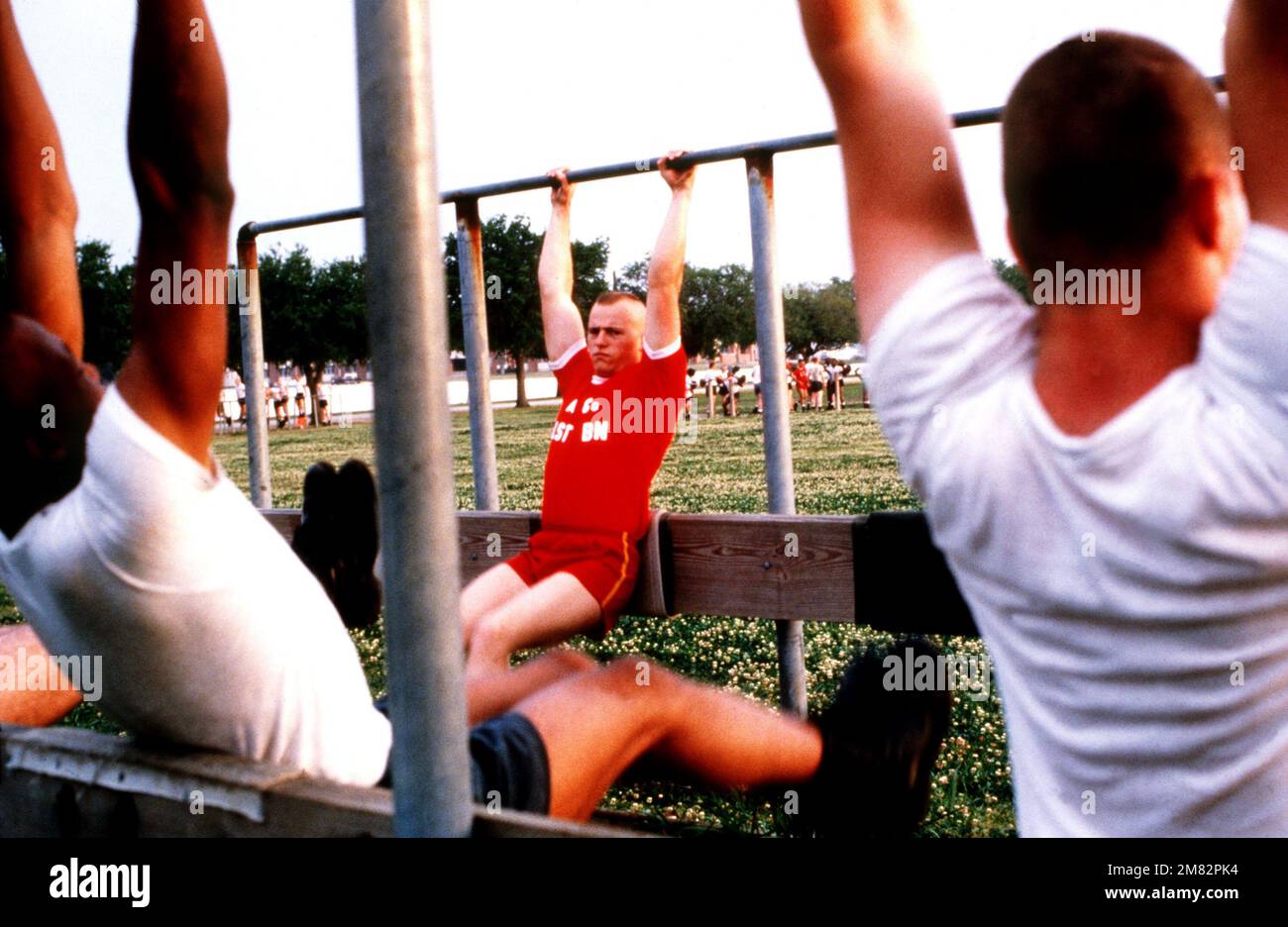 Marine recruits perform leg lift exercises during basic training at the ...