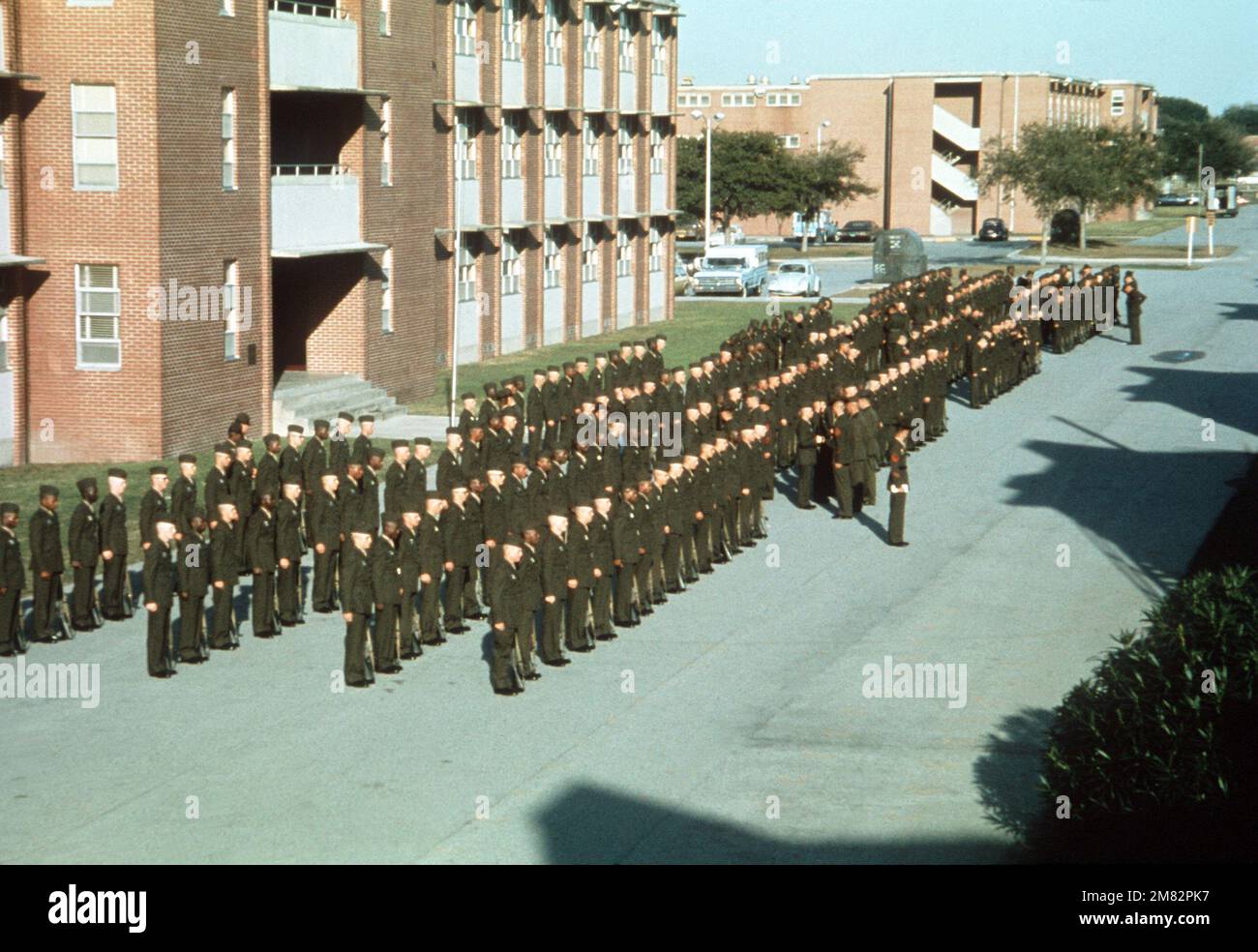 Marine recruits stand in ranks outside their barracks, as a personnel ...