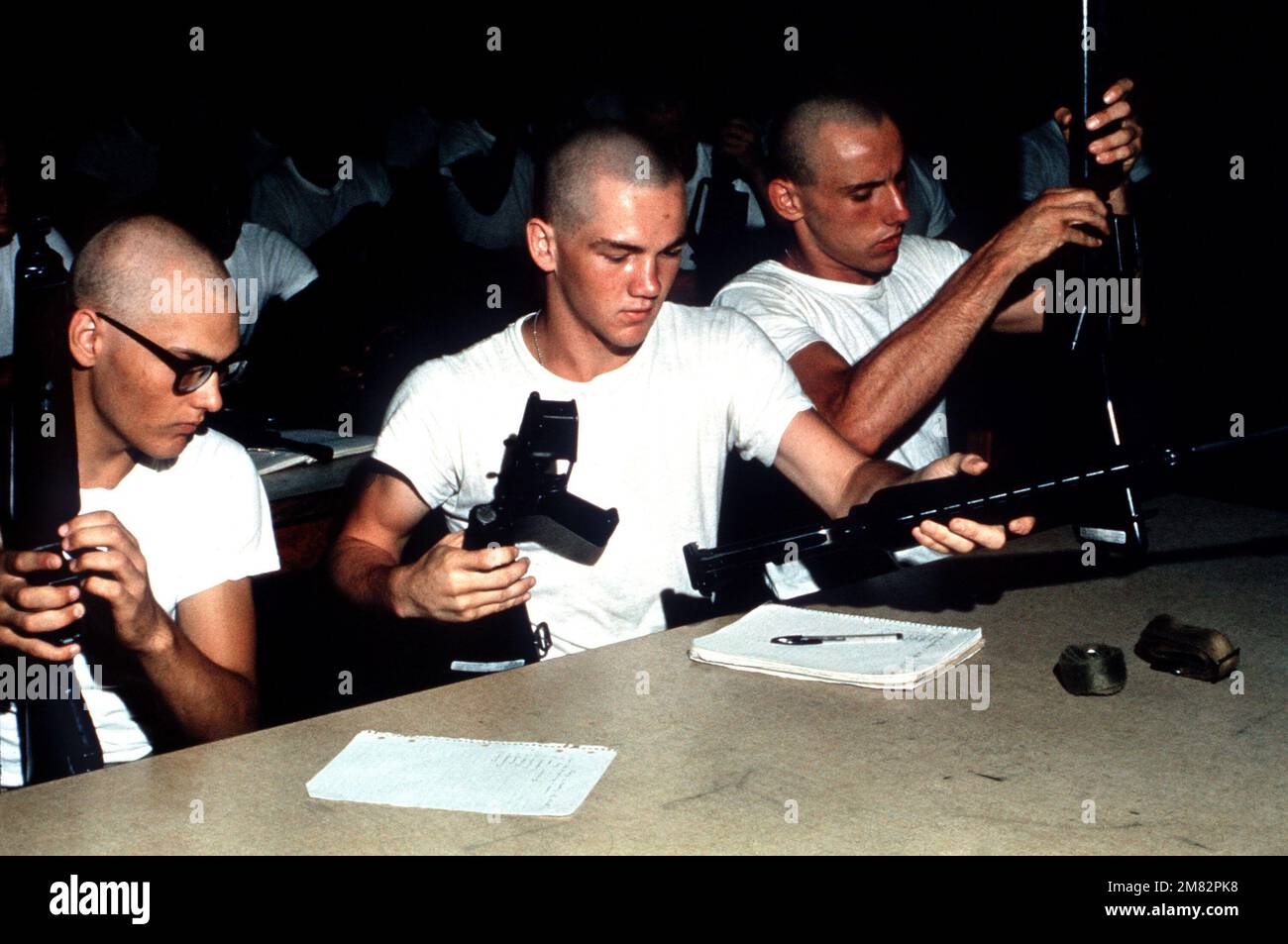 Marine recruits learn how to field strip M16A1 rifles during basic ...