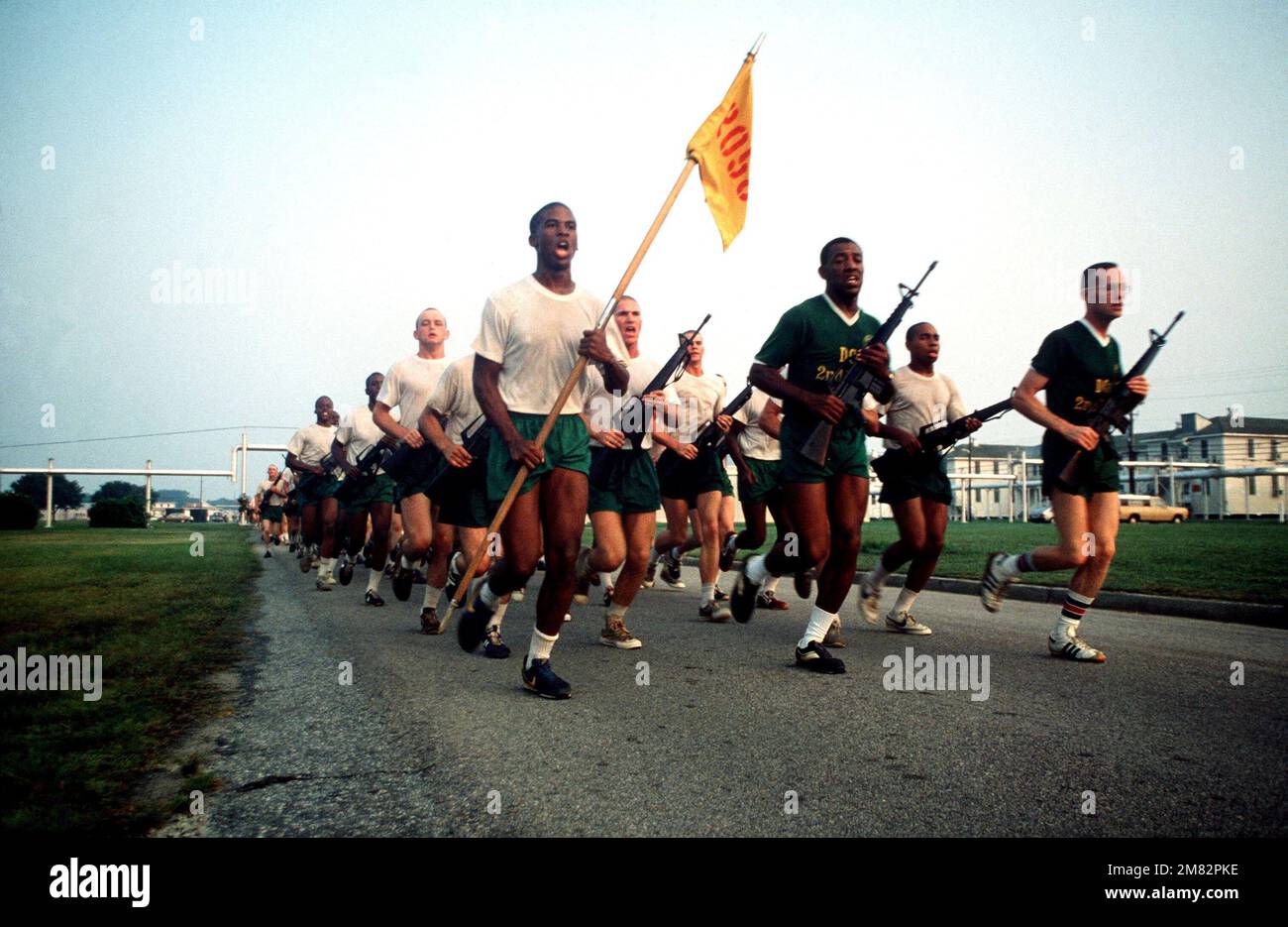 Marine recruits carry their M16A1 rifles during physical training at ...