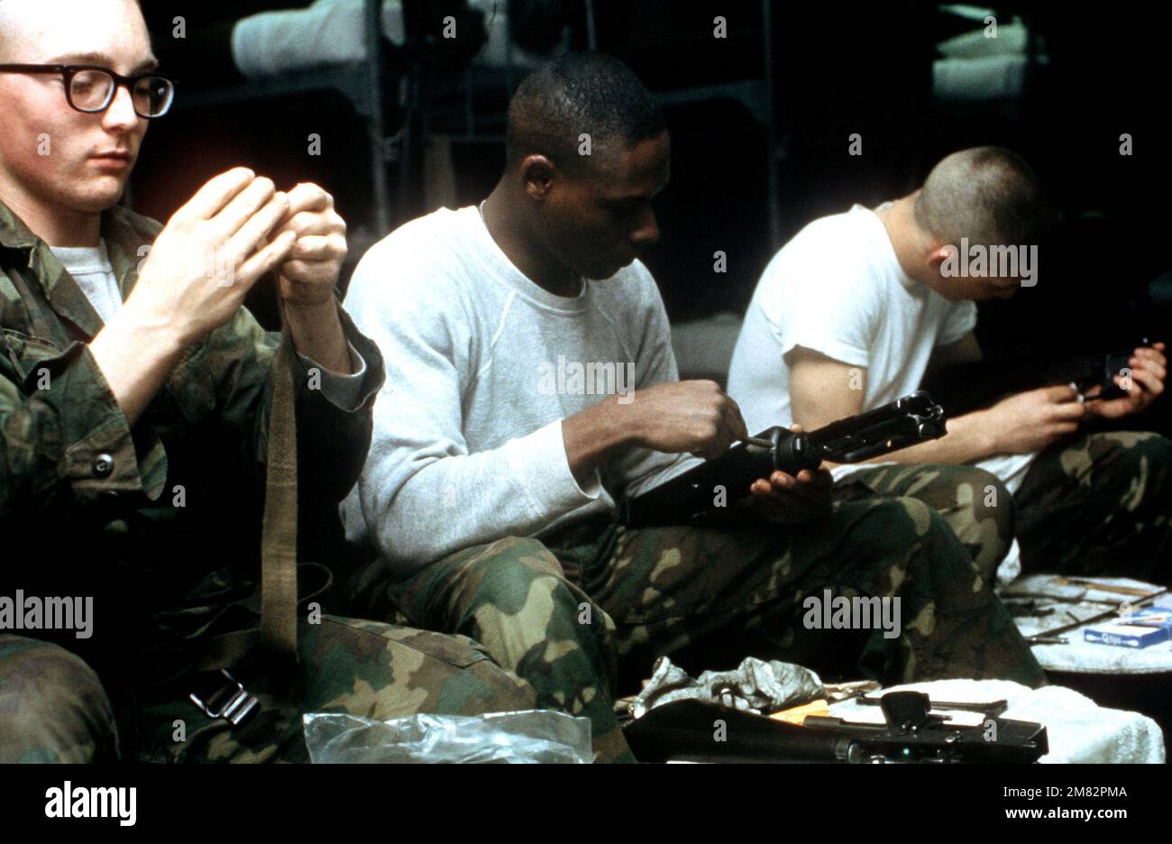 Marine recruits clean their M16A1 rifles in preparation for an ...