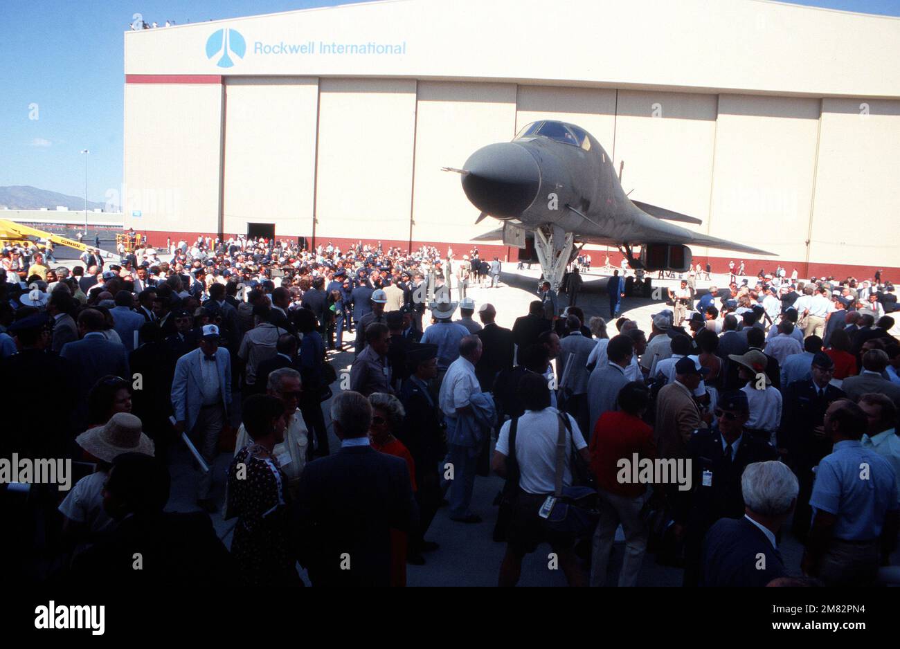 A crowd gathers to view the first production model B-1B aircraft during ... A crowd gathers to view the first production model B-1B aircraft during ...