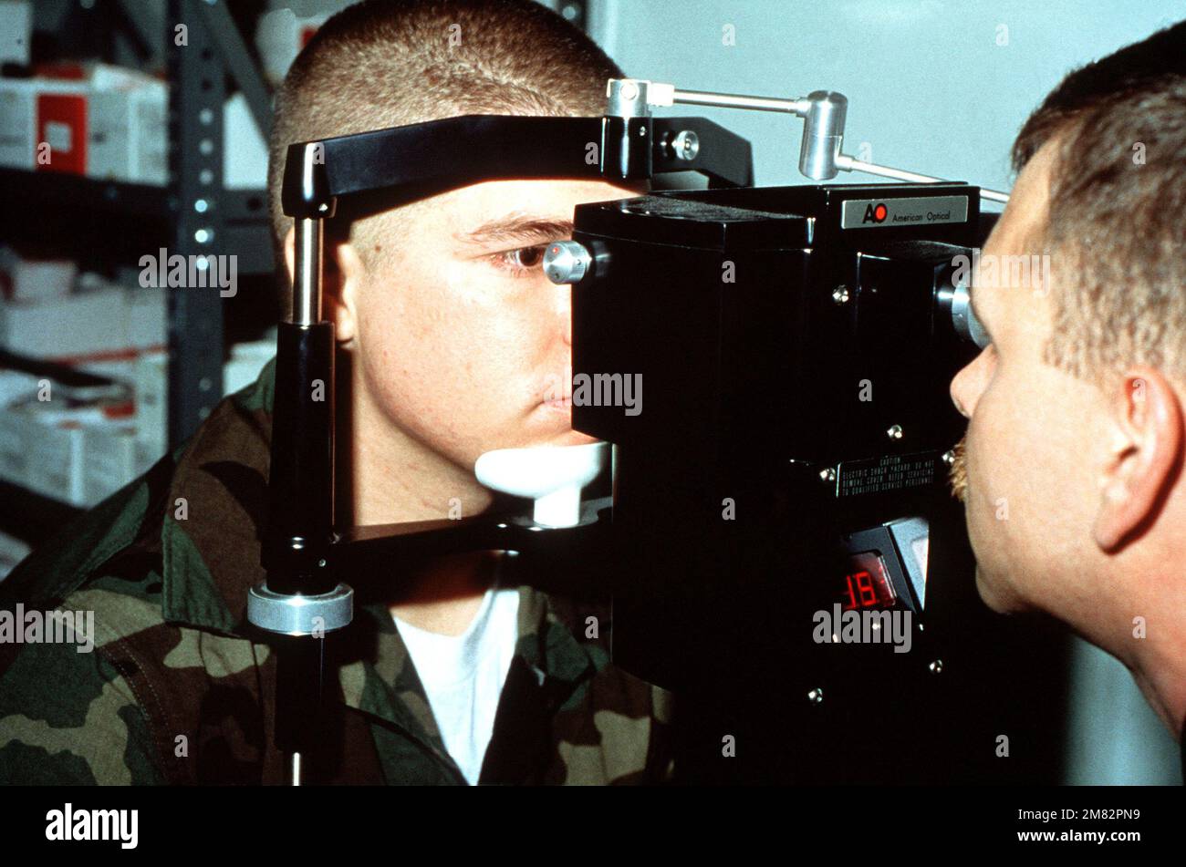 A Marine recruit receives an eye examination during basic training at ...