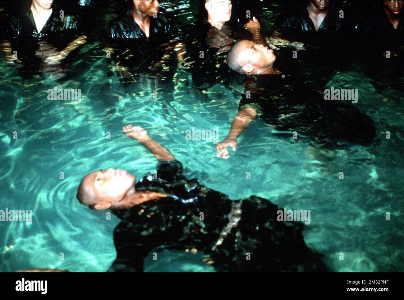 Marine recruits are taught water survival during basic training at the ...