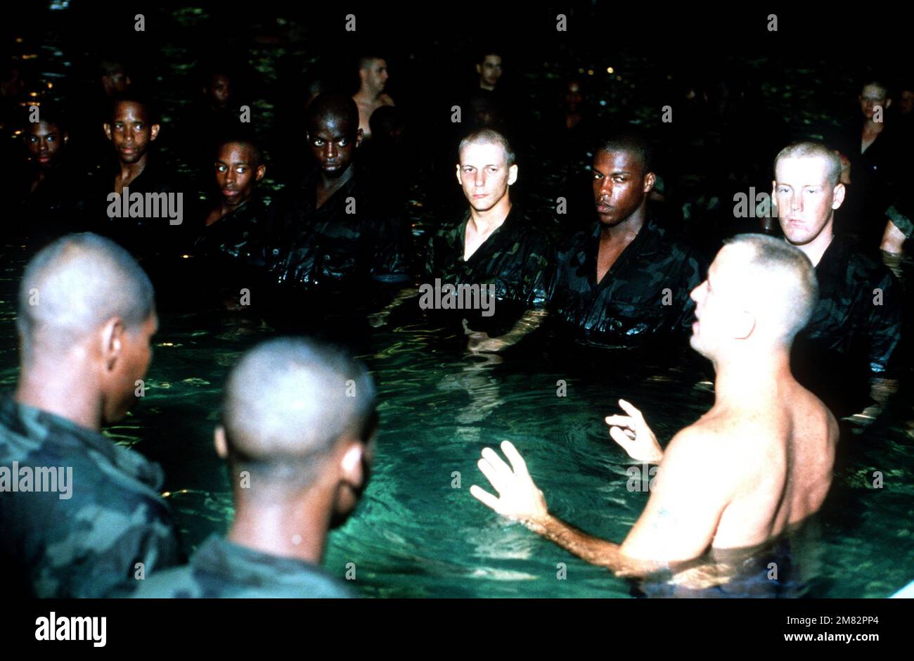 Marine recruits are taught water survival during basic training at the ...