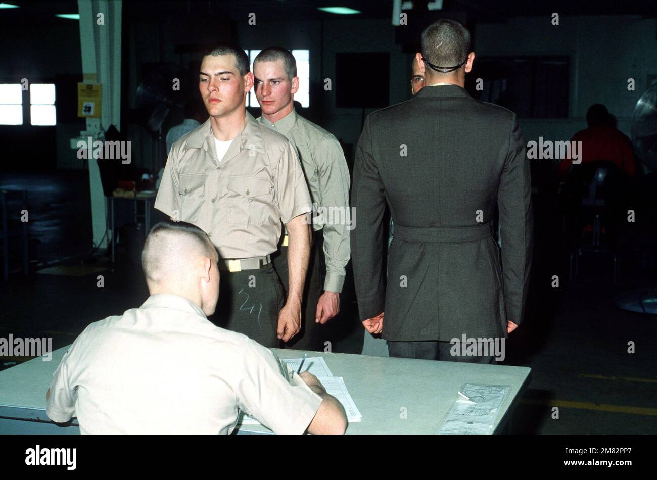 Marine recruits are fitted for dress uniforms during basic training at ...