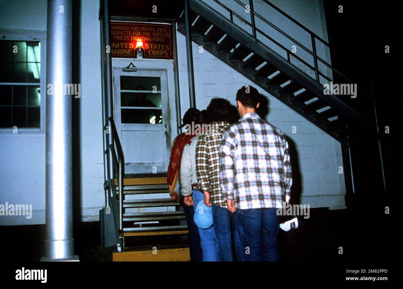 Marine recruits line up for processing upon their arrival to begin ...