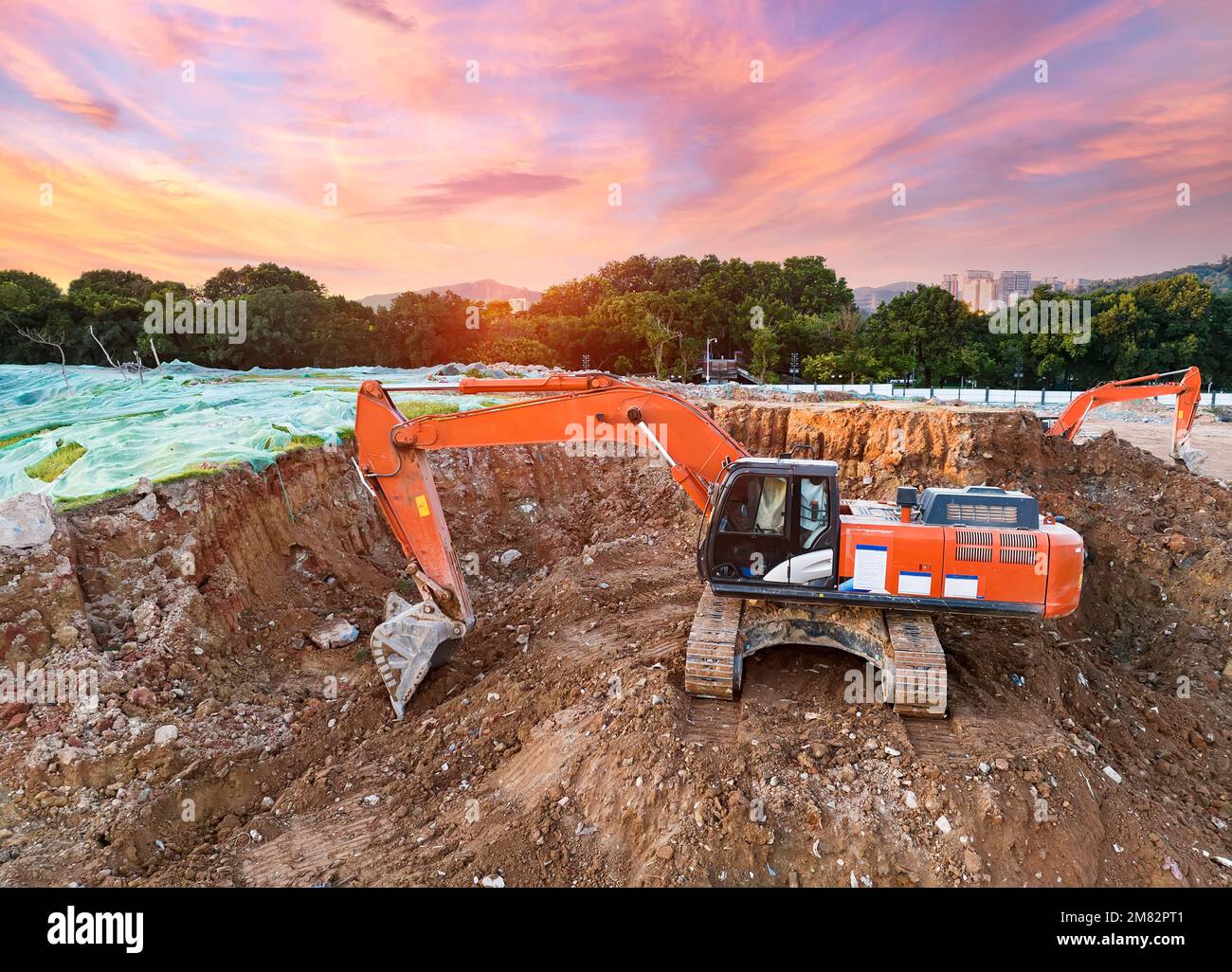 Excavator on earthmoving at construction site, aerial view Stock Photo ...