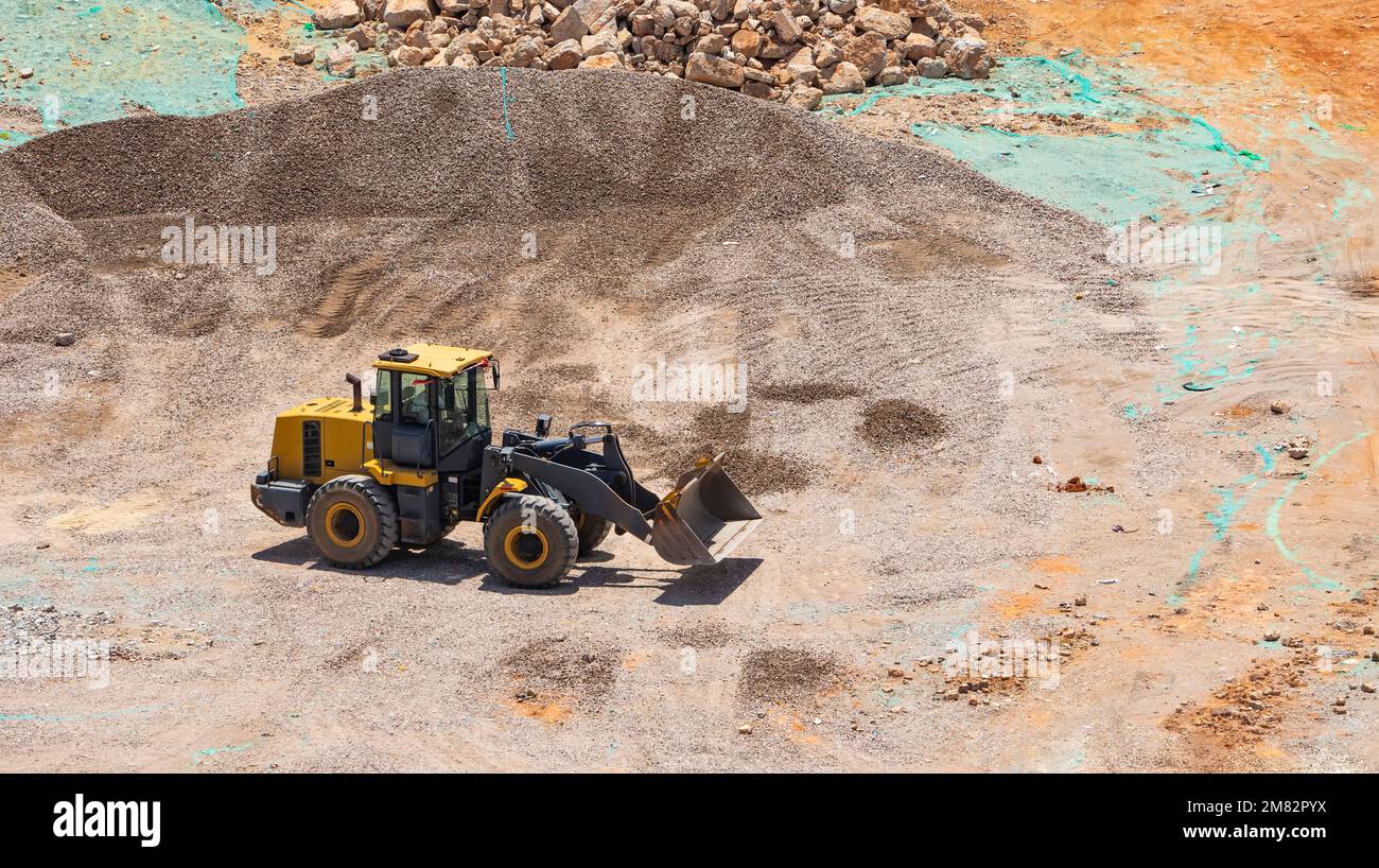 excavator loader machine during earthmoving works outdoors Stock Photo ...