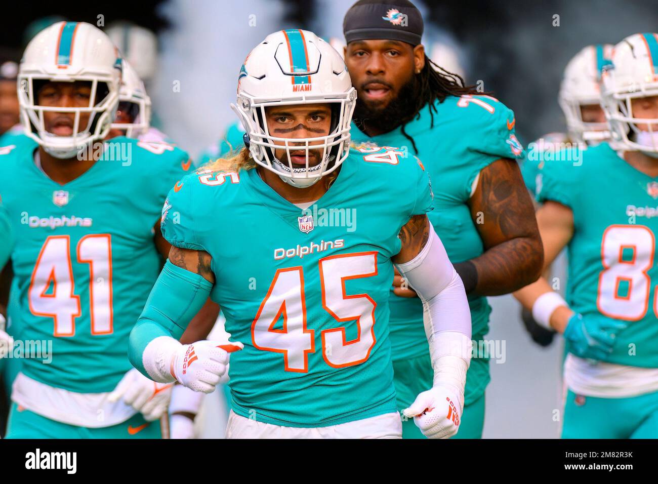 Miami Dolphins linebacker Duke Riley (45) runs onto the field before an ...
