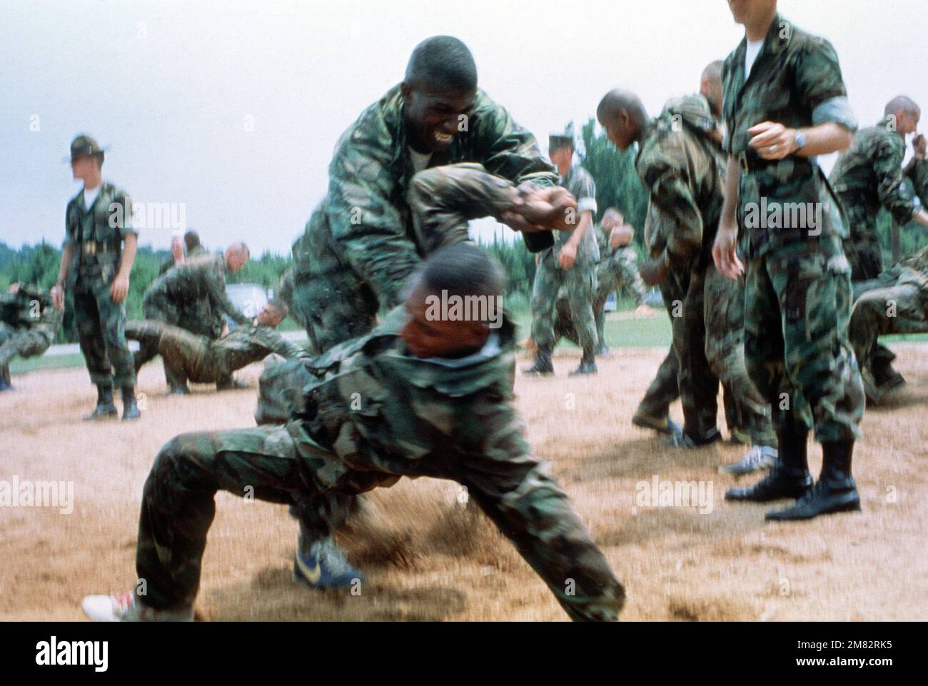 Recruits practice hand-to-hand combat techniques during basic training ...
