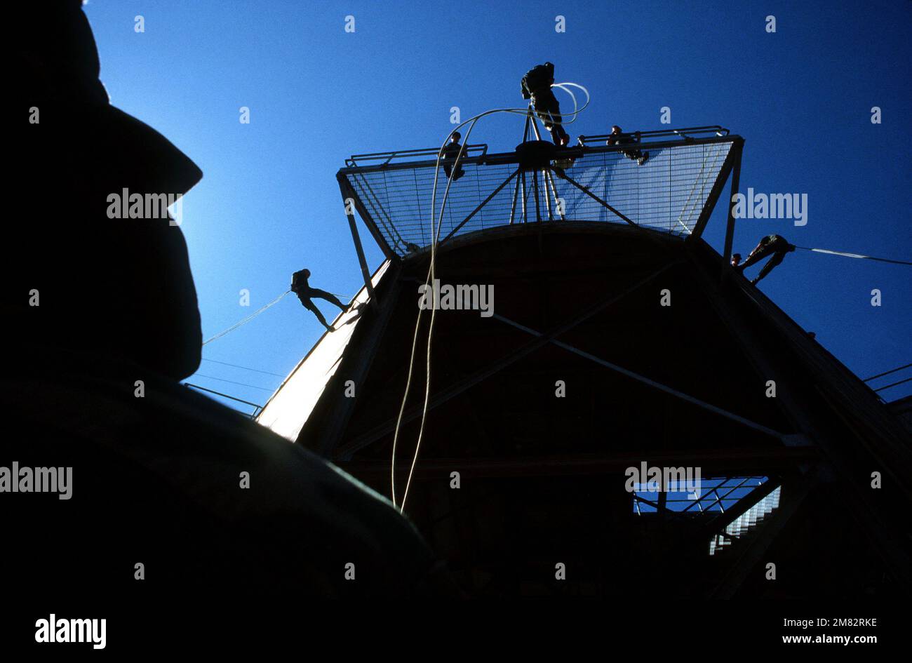 Recruits rappel from a tower during basic training at the Marine Corps ...