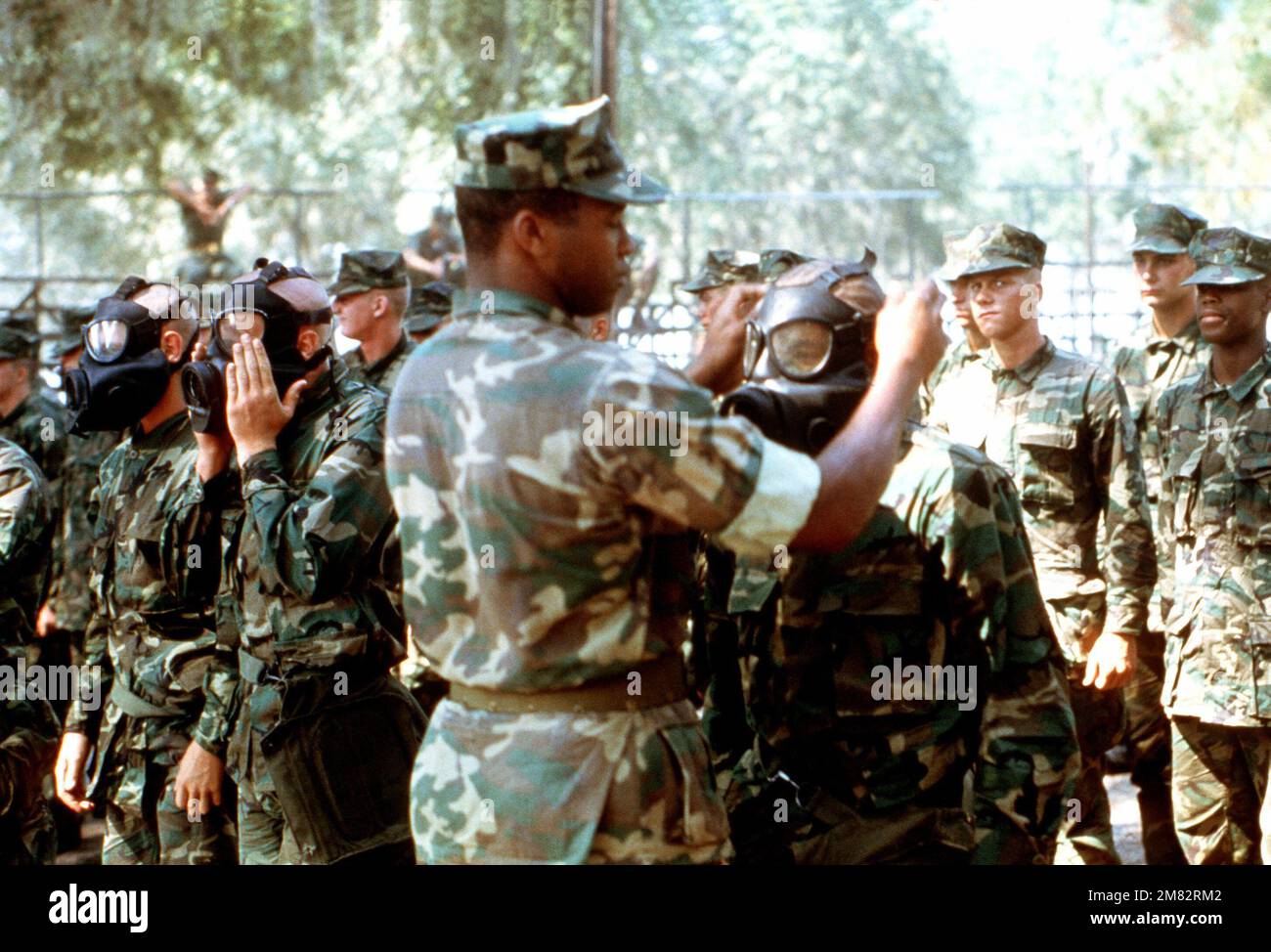 Recruits put on ABC-M17 chemical-biological masks during a gas chamber ...