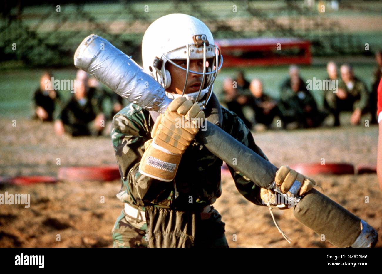A recruit practices pugil-stick techniques during hand-to-hand combat training at the Marine ...