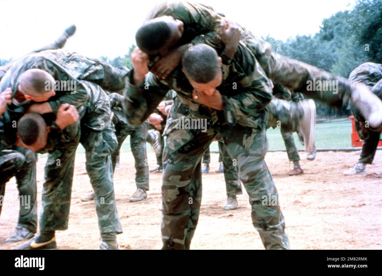 Recruits practice hand-to-hand combat techniques during basic training ...