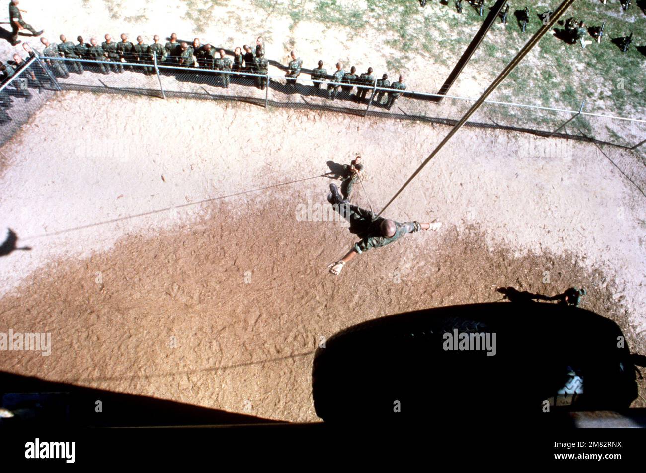 A recruit rappels from a tower during basic training at the Marine ...