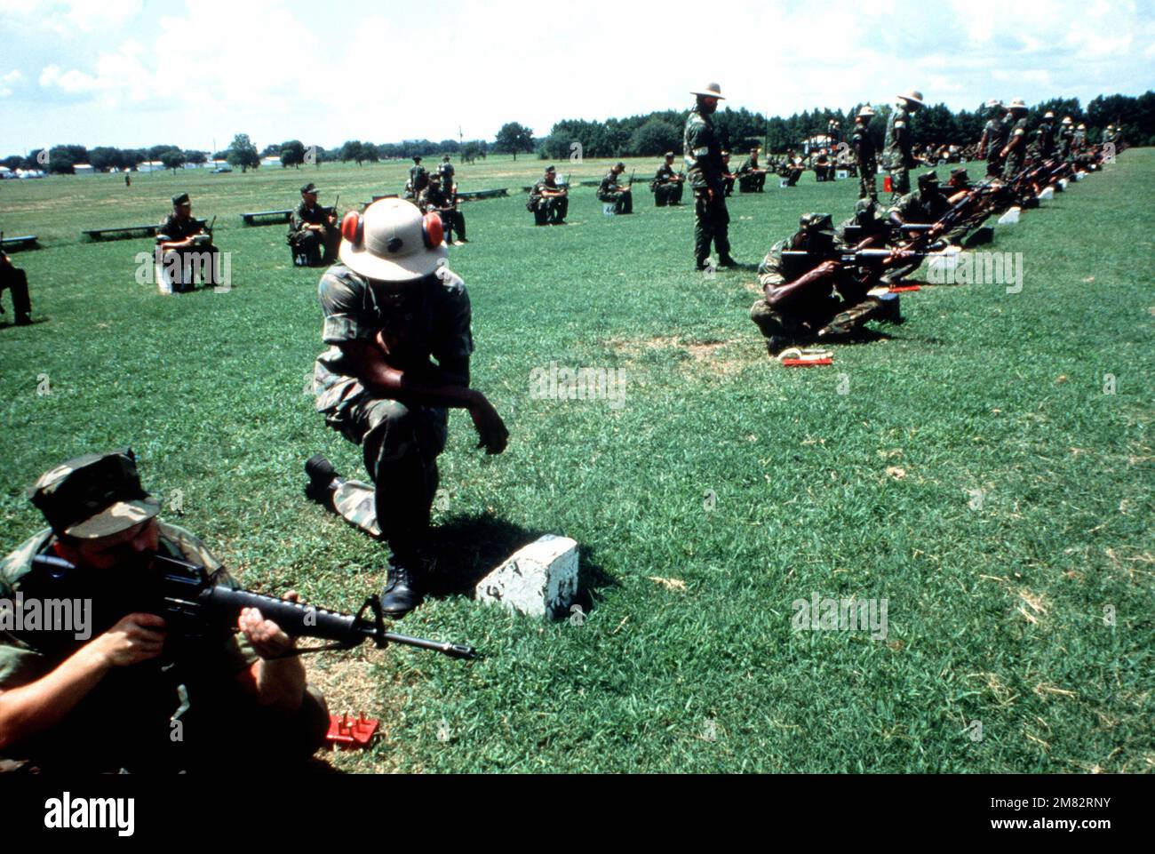 Recruits fire their M16A1 rifles on the firing range during basic ...