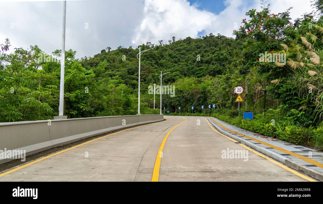 Landscape with road on hill Stock Photo - Alamy