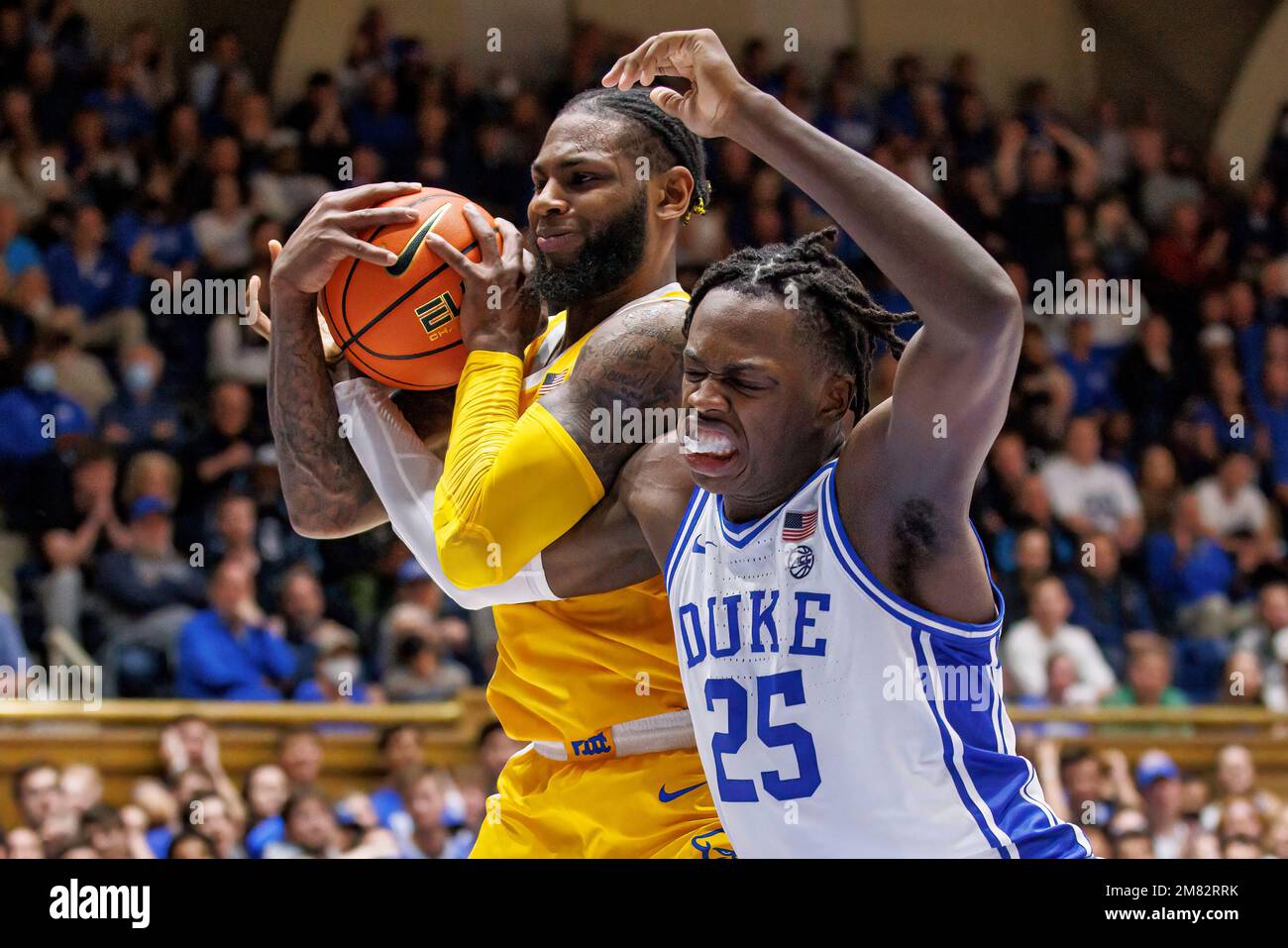 Pittsburgh's Jamarius Burton, left, and Duke's Mark Mitchell (25 ...